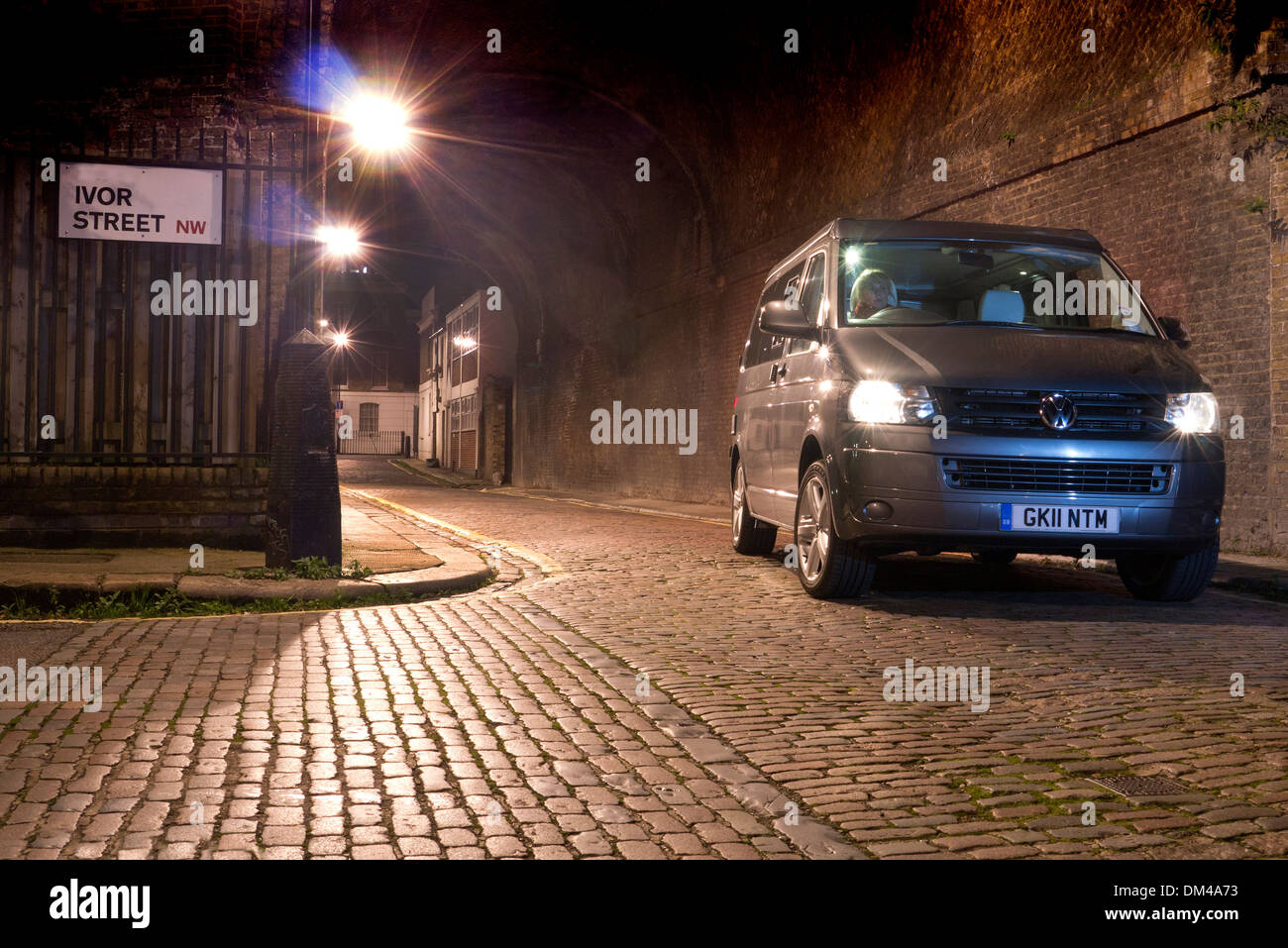 VW camper van driving on a London street at night Stock Photo - Alamy