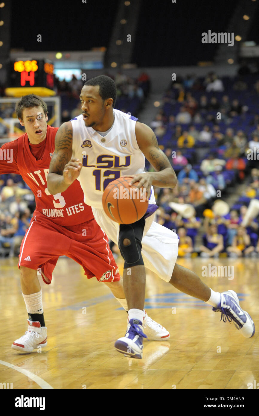LSU guard, #12 Aaron Dotson, drives around Utah guard, #3 Jace Tavita ...