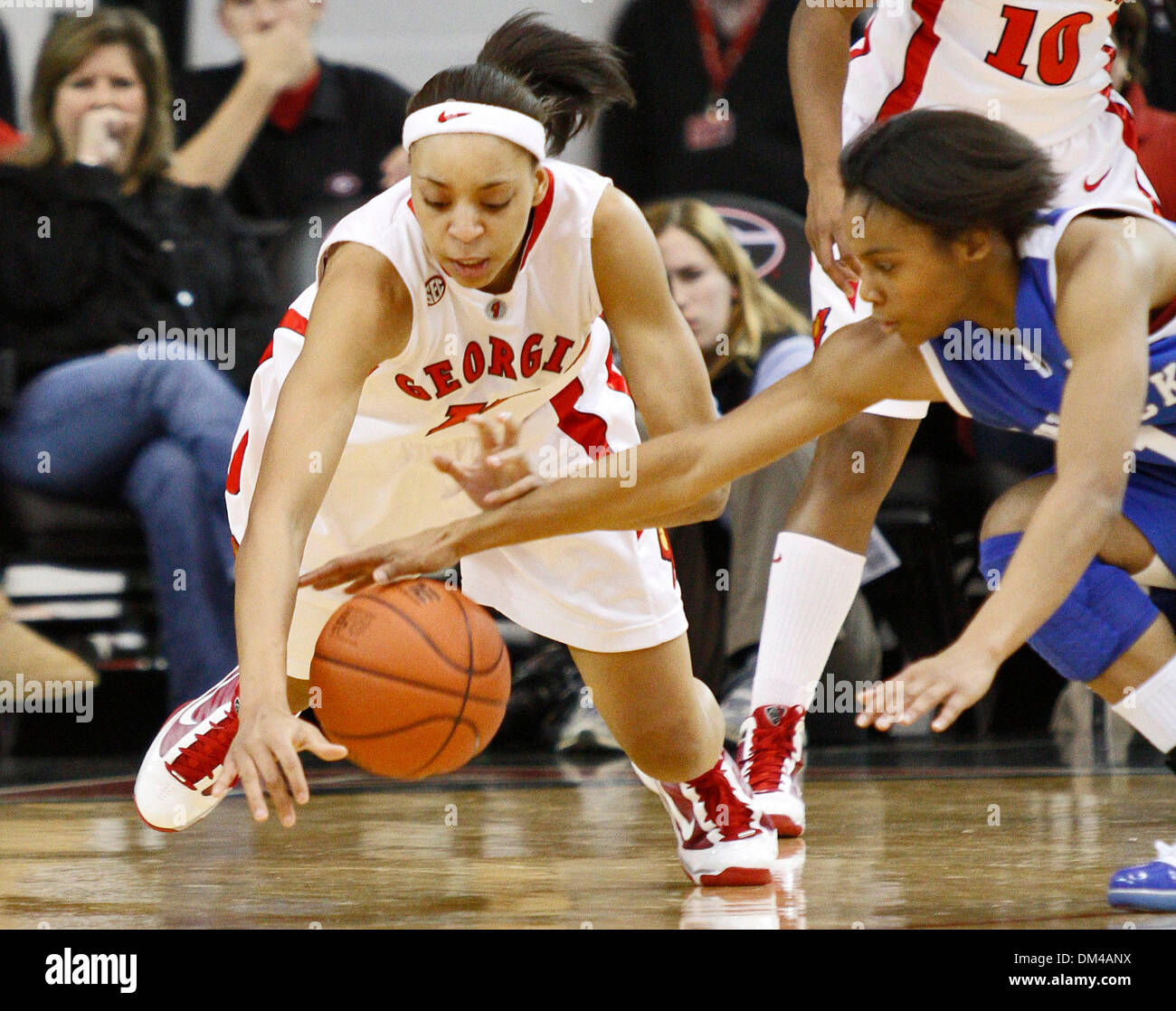 Georgia guard Meredith Mitchell (11) dives for a loose ball at the game ...