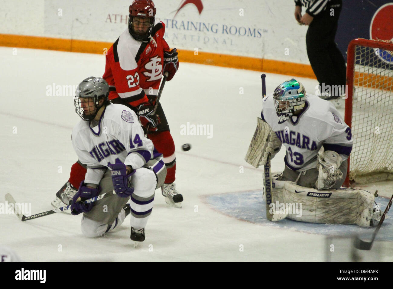NCAA Non-Conference Game - NU's Derek Foam (14) and SLU's Drew Weaver ...