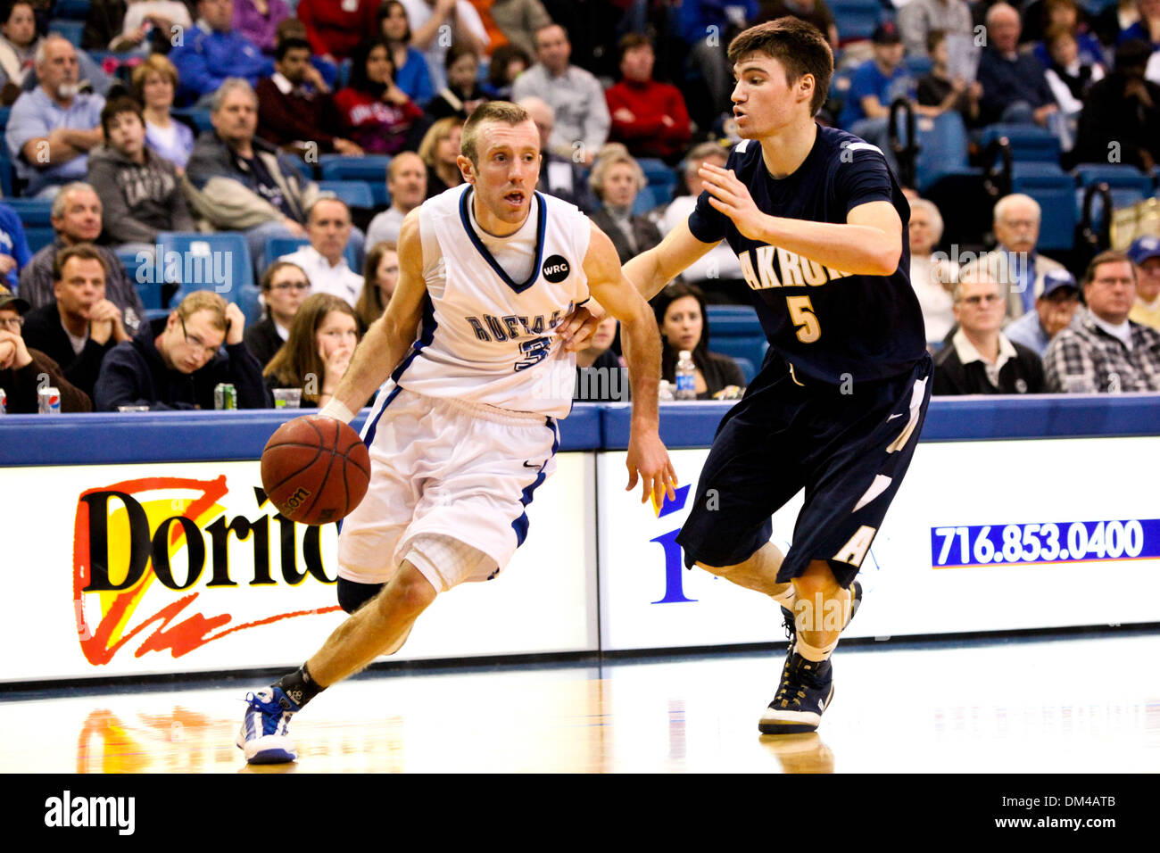 University at Buffalo's Alex Sullivan (3) moves around University at ...