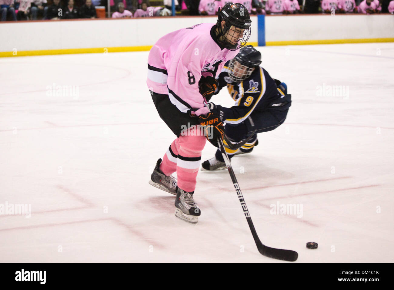 RIT's Chris Tanev (8) moves around Bentley's Brendan Harriso (9) during ...