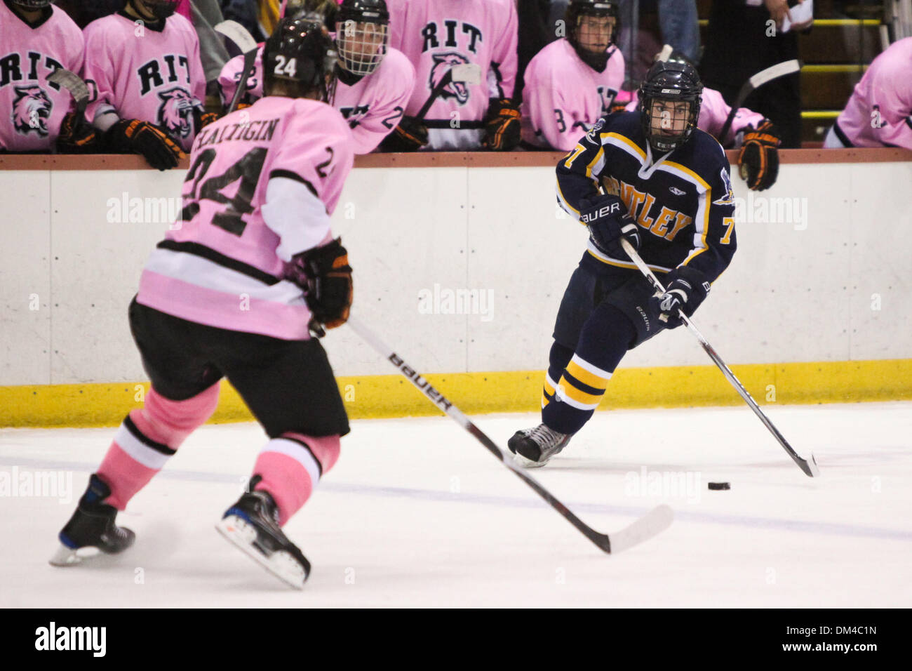 Bentley's Erik Peterson (7) looks to move around RIT's Chris Haltigin ...