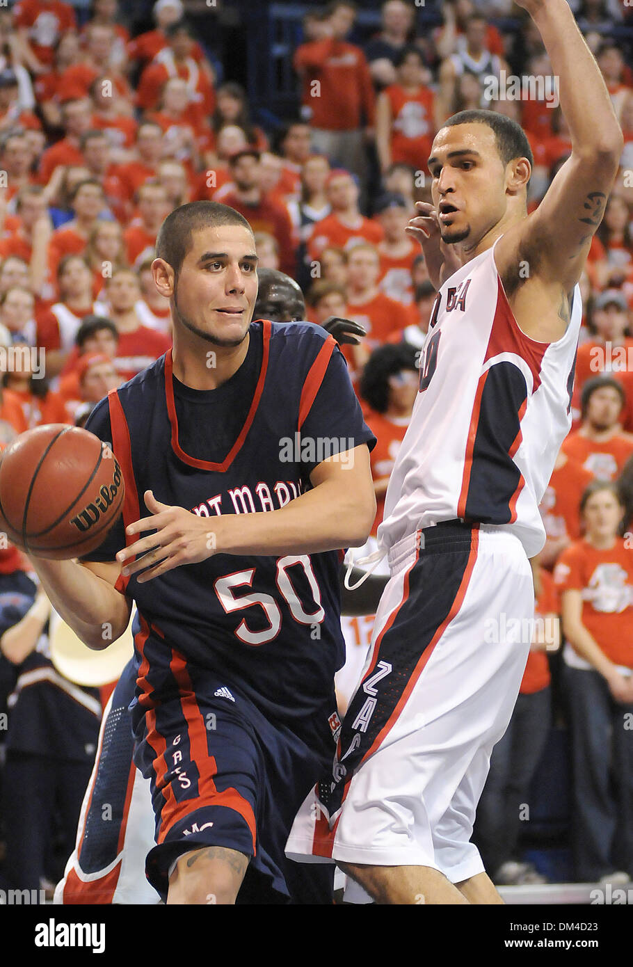 Saint Mary's center Omar Samhan (50) tries to pass the ball back out ...