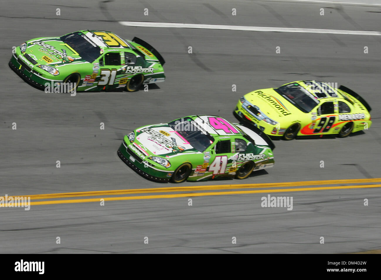 Stanton Barrett (No. 31) leads Chrissy Wallace (No. 41 and Paul Menard ...