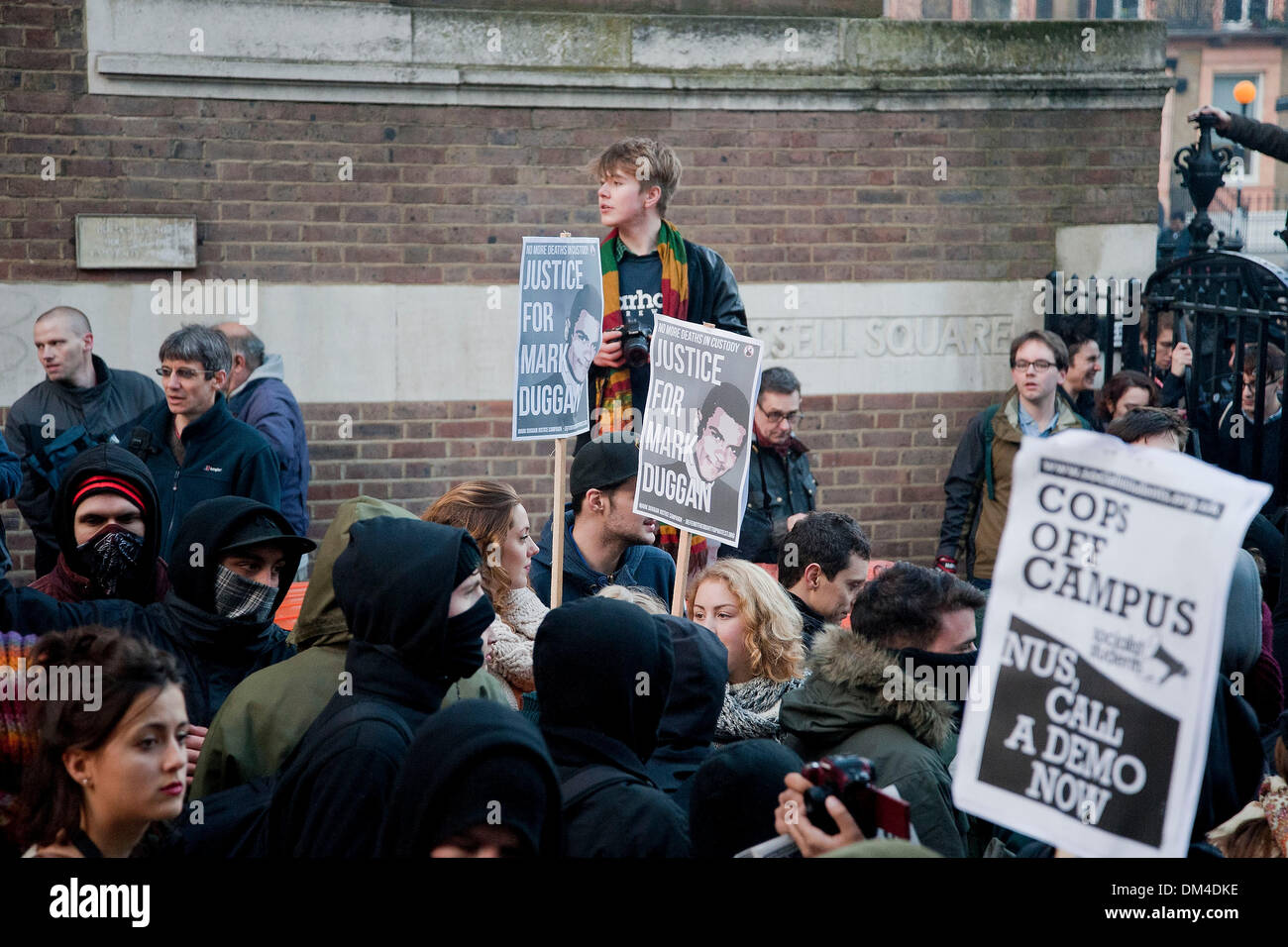London, UK. 11th December 2013. Students set fire to bins and try to ...