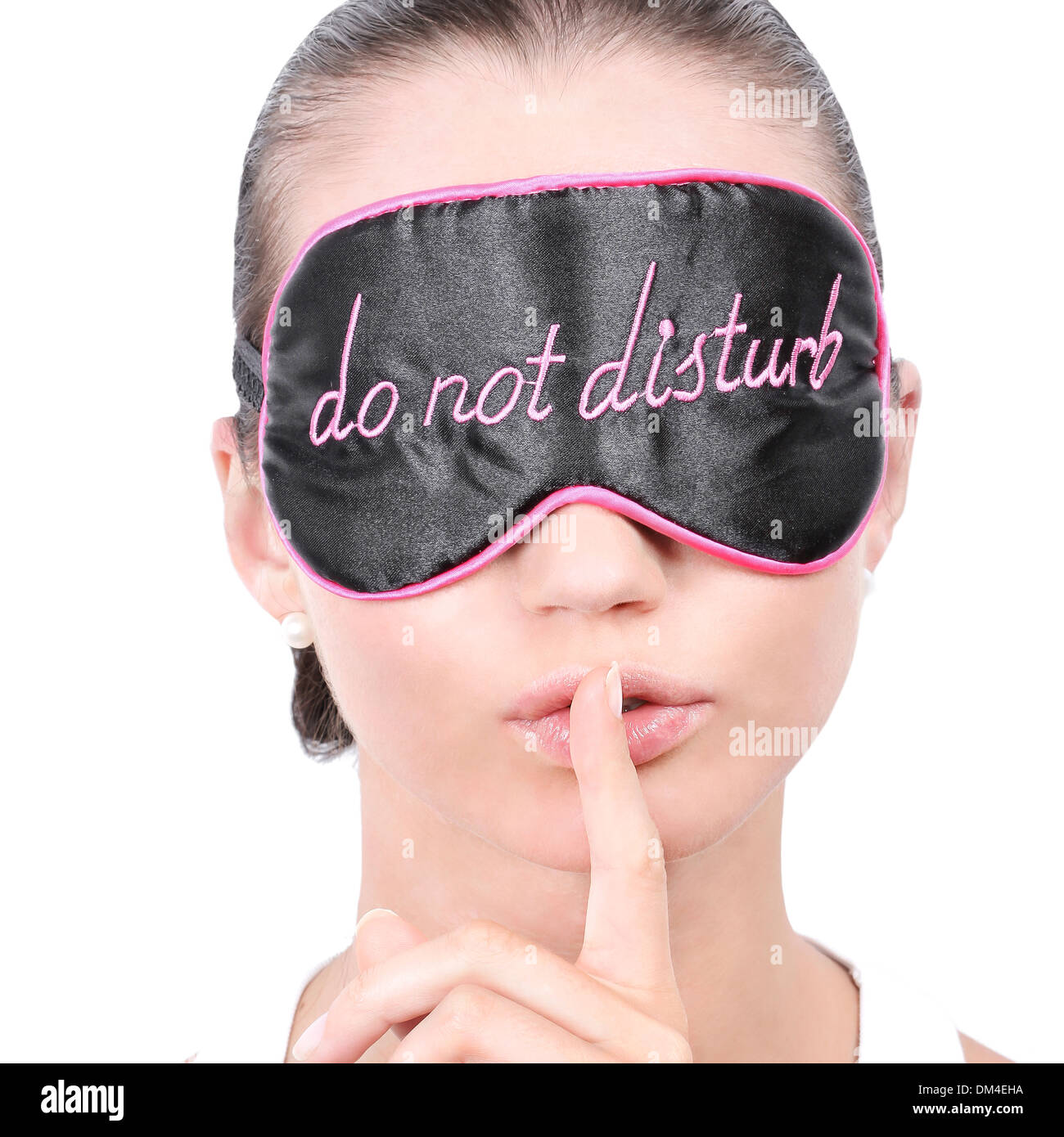 Woman in sleeping mask making a keep it quiet gesture Stock Photo - Alamy