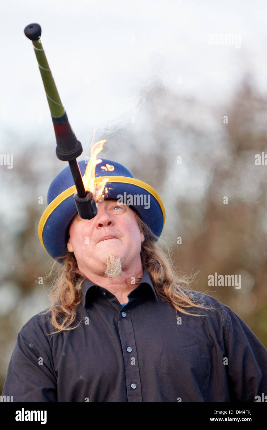 Children's entertainer Jonathan the Jester fire juggling Stock Photo ...