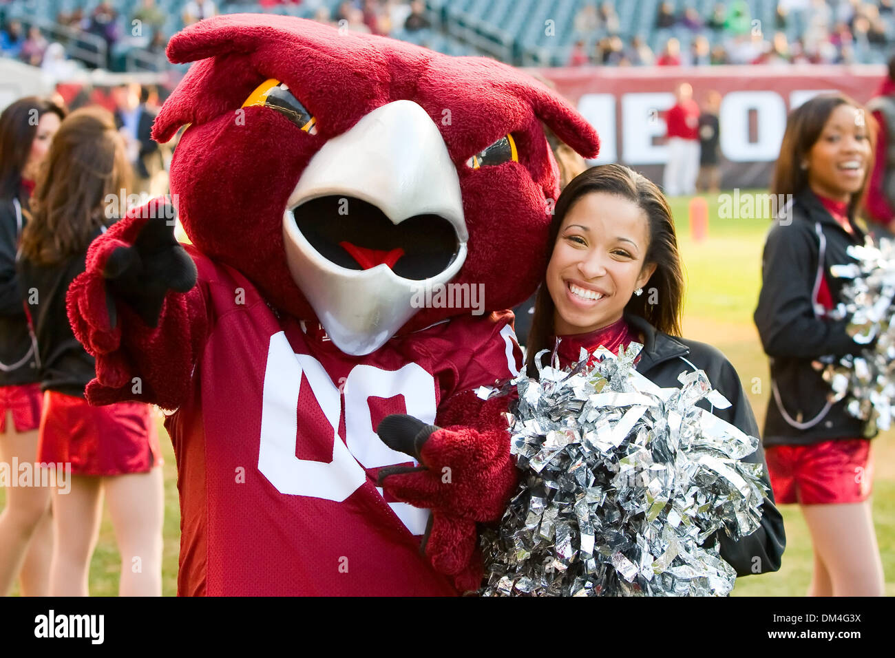 Temple Owls Mascot, Hooter, posing with one of the members of the ...