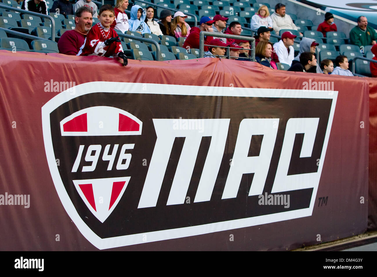 A young Temple Owls fan hitting the MAC sign during the NCAA football ...
