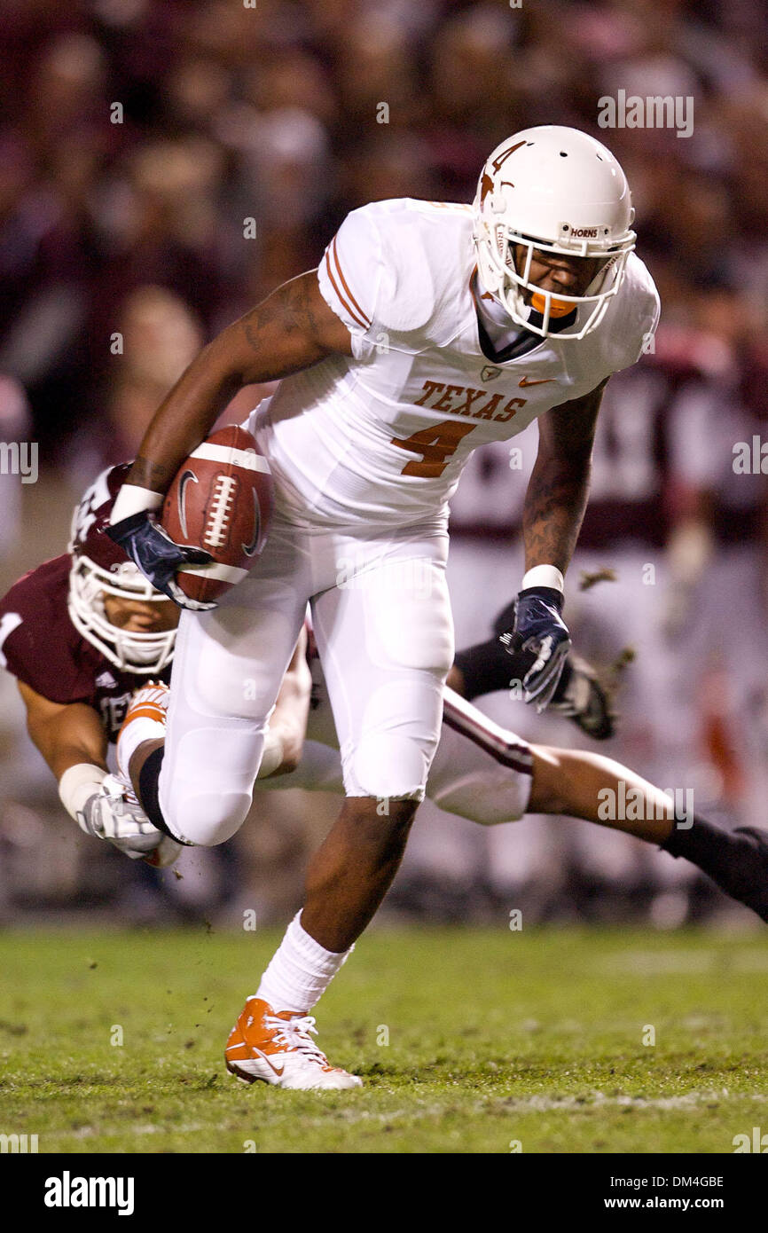 Dan Buckner (#4) of the University of Texas Longhorns keeps his footing ...
