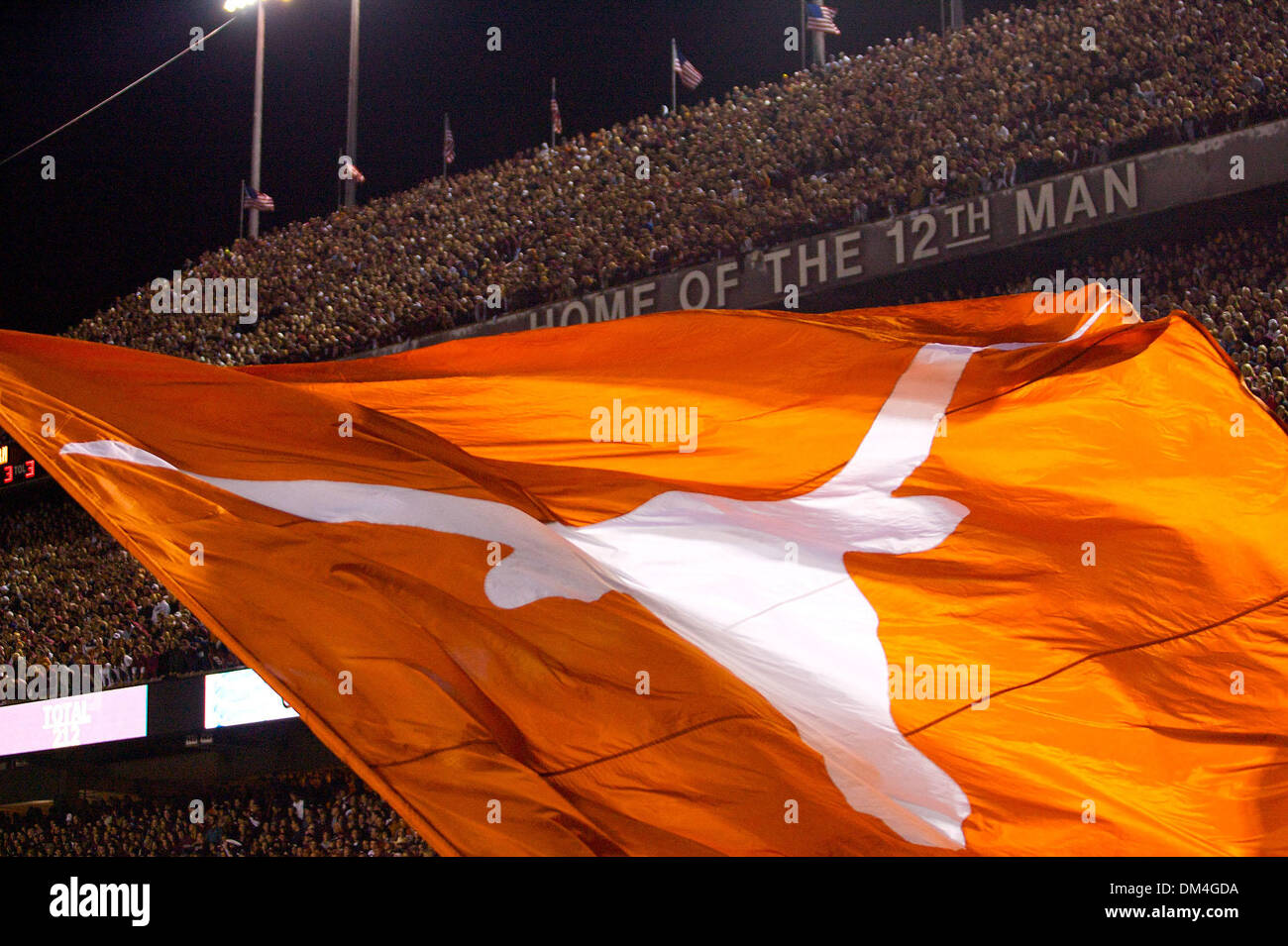 A giant University of Texas Longhorn flag waves in celebration in front ...