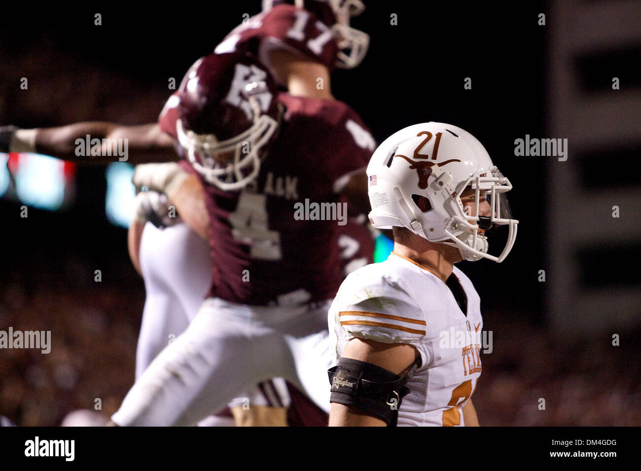 Ryan Tannehill (#17) of the Texas A&M Aggies and Jamie McCoy (#4) of ...