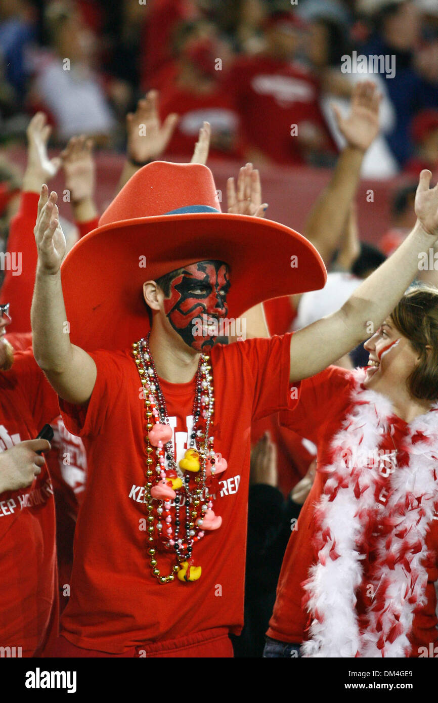 A University of Houston fan in the stands celebrates a UH touchdown ...