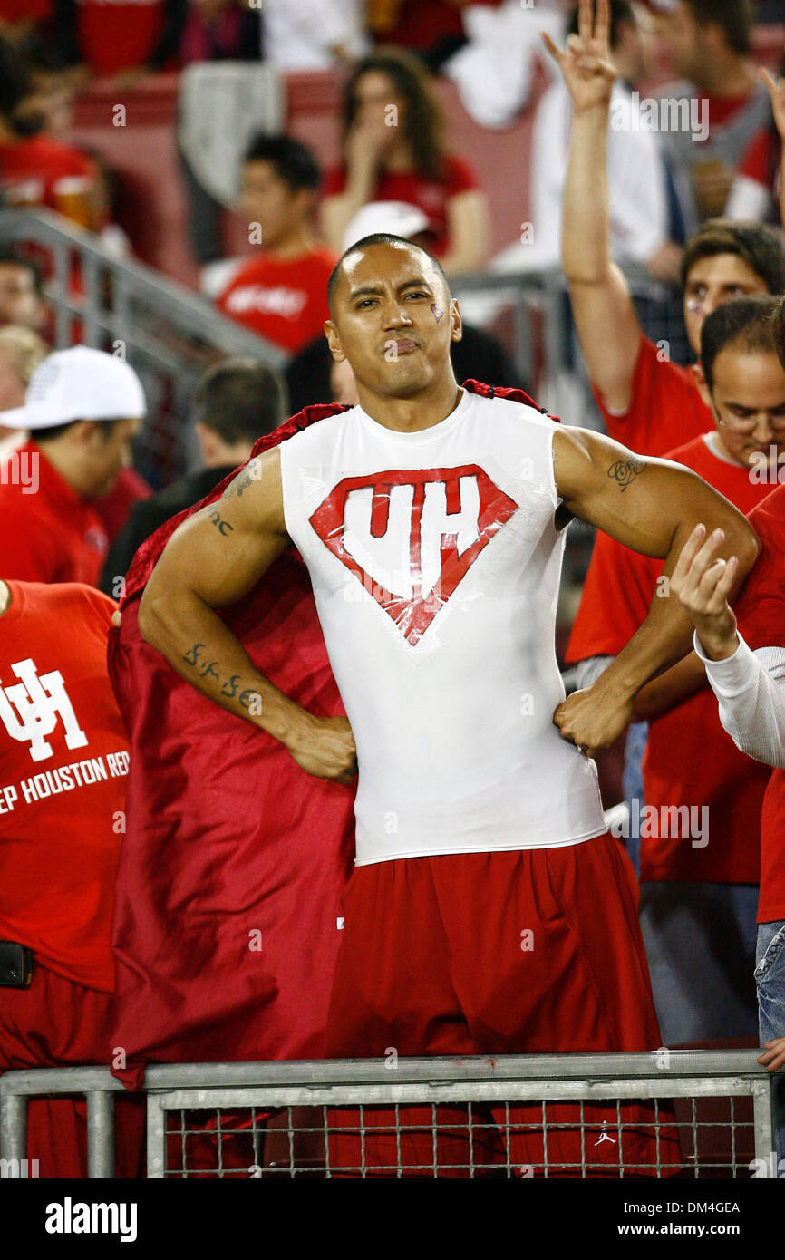 A University of Houston fan in the stands celebrates a UH touchdown ...
