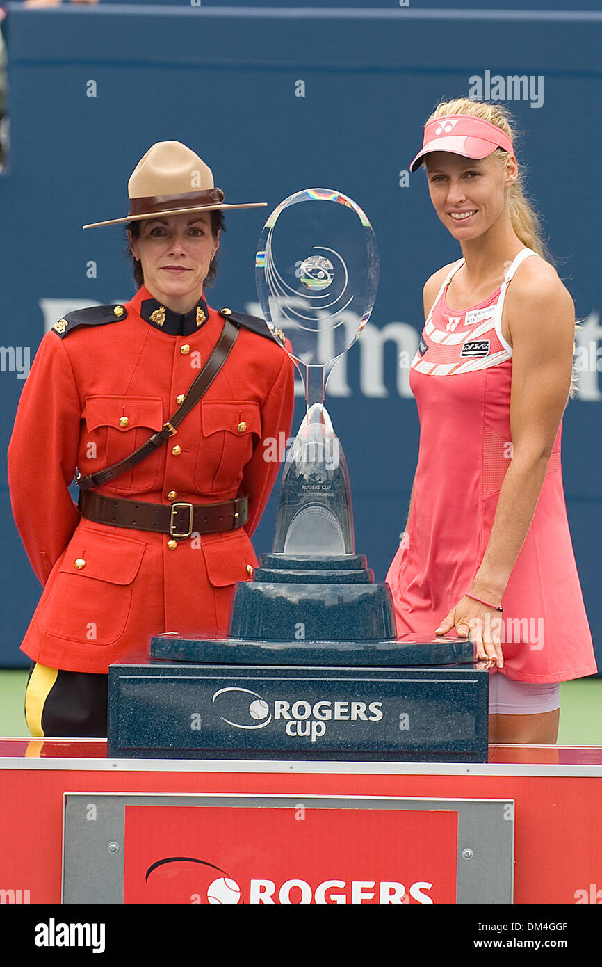 Elena Dementieva (RUS) poses with an RCMP officer and the winners ...