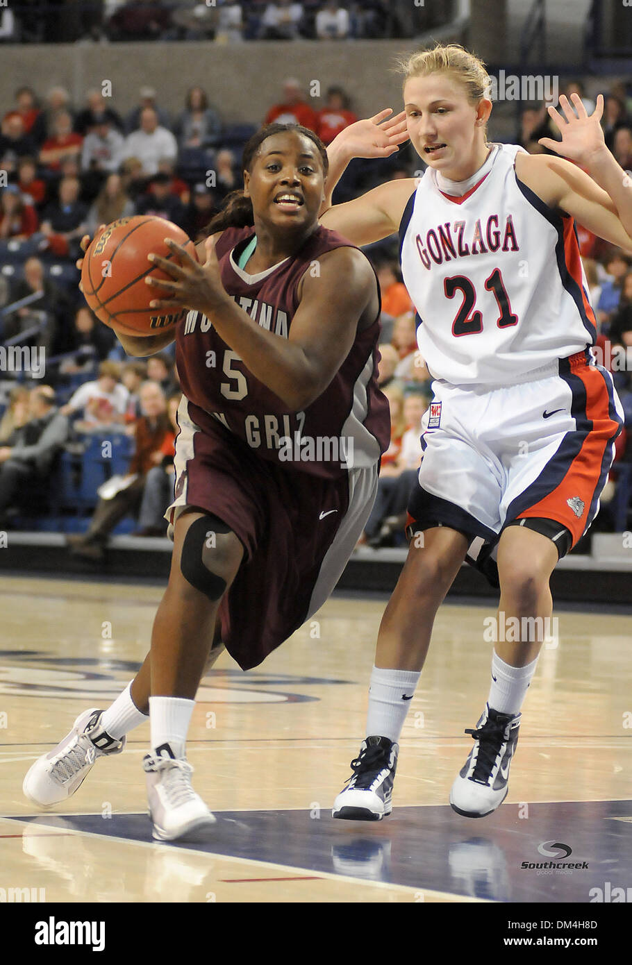 Montana's Shaunte Nance-Johnson (5) drives the lane past Gonzaga's ...
