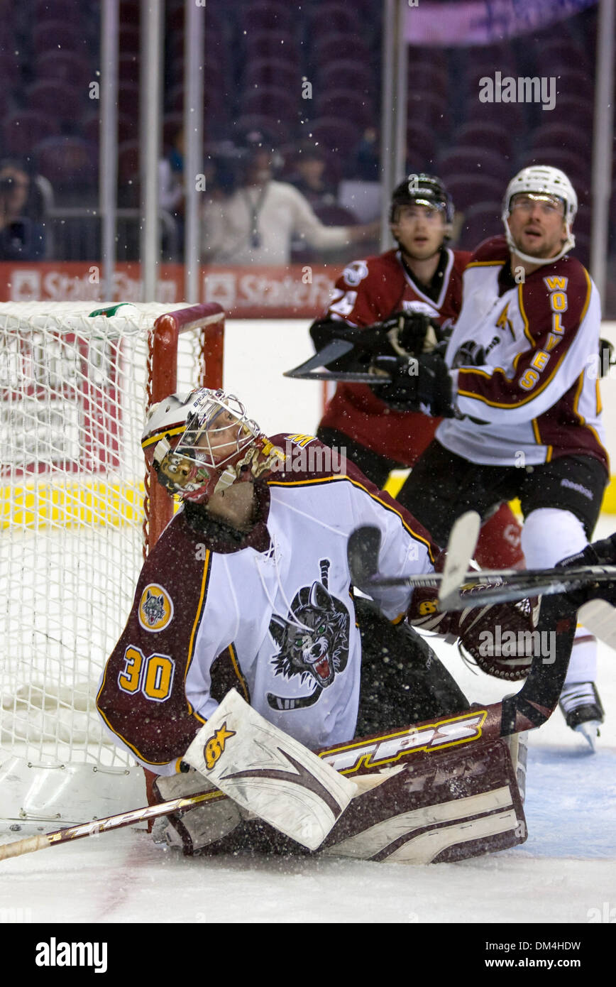 13 December 2009: A puck deflects off Chicago Wolves goalie Drew ...