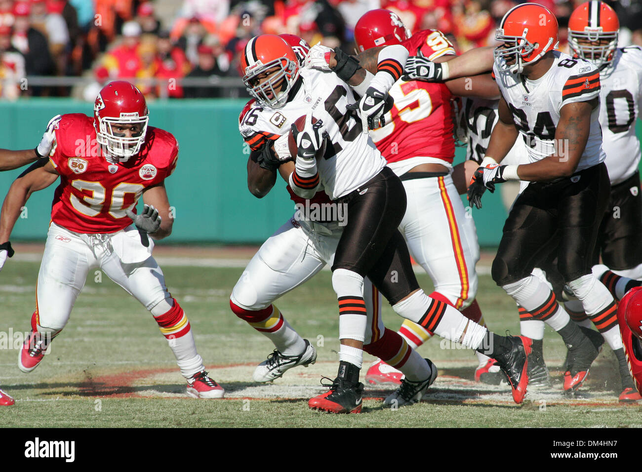 Cleveland Browns wide receiver Josh Cribbs (16) fights for yardage ...