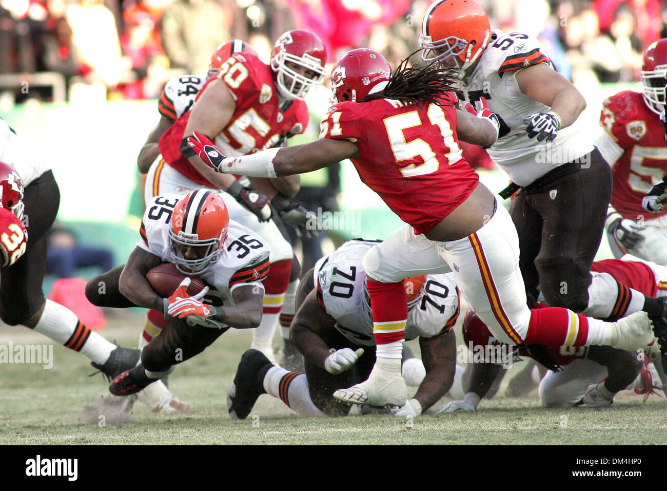 Cleveland Browns running back Jerome Harrison (35) dives under the hand ...