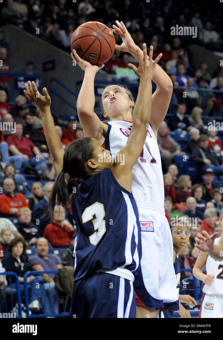 Gonzaga's Janelle Bekkering, right, makes a basket over UC Irvine's ...