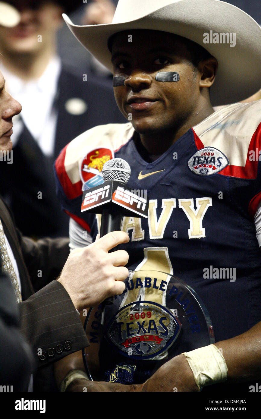 Navy Midshipmen Quarterback Ricky Dobbs (4) is awarded the Texas Bowl ...
