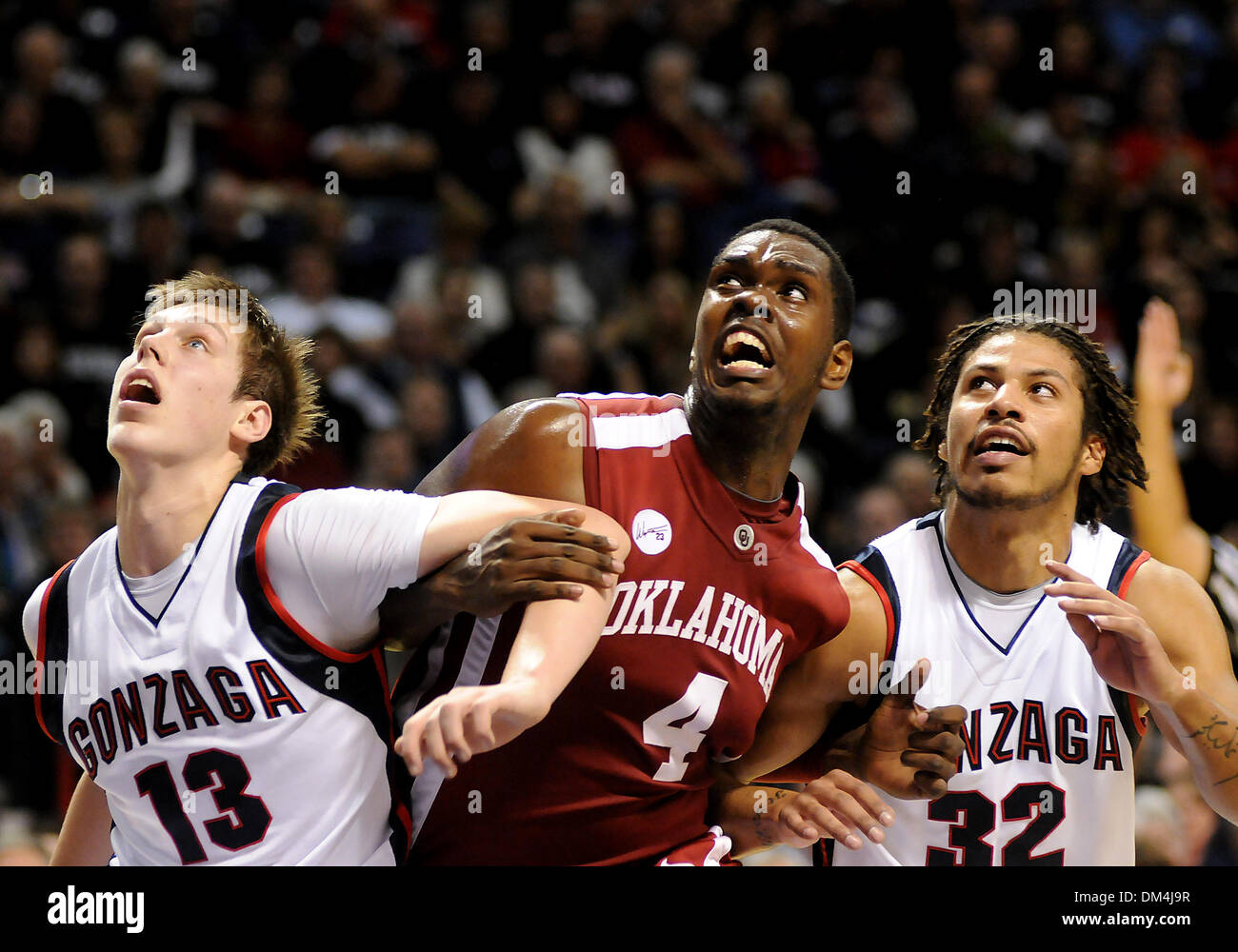 Oklahoma's Andrew Fitzgerald (4) fights for position with Gonzaga's ...