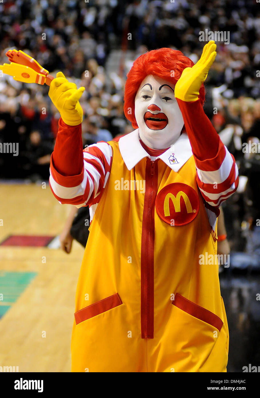 Ronald McDonald entertains the crowd during a NCAA college basketball ...