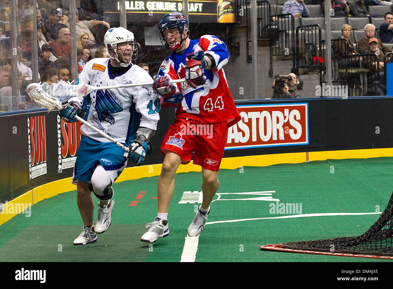 Rochester Knighthawks forward Scott Evans #19 battles behind the ...