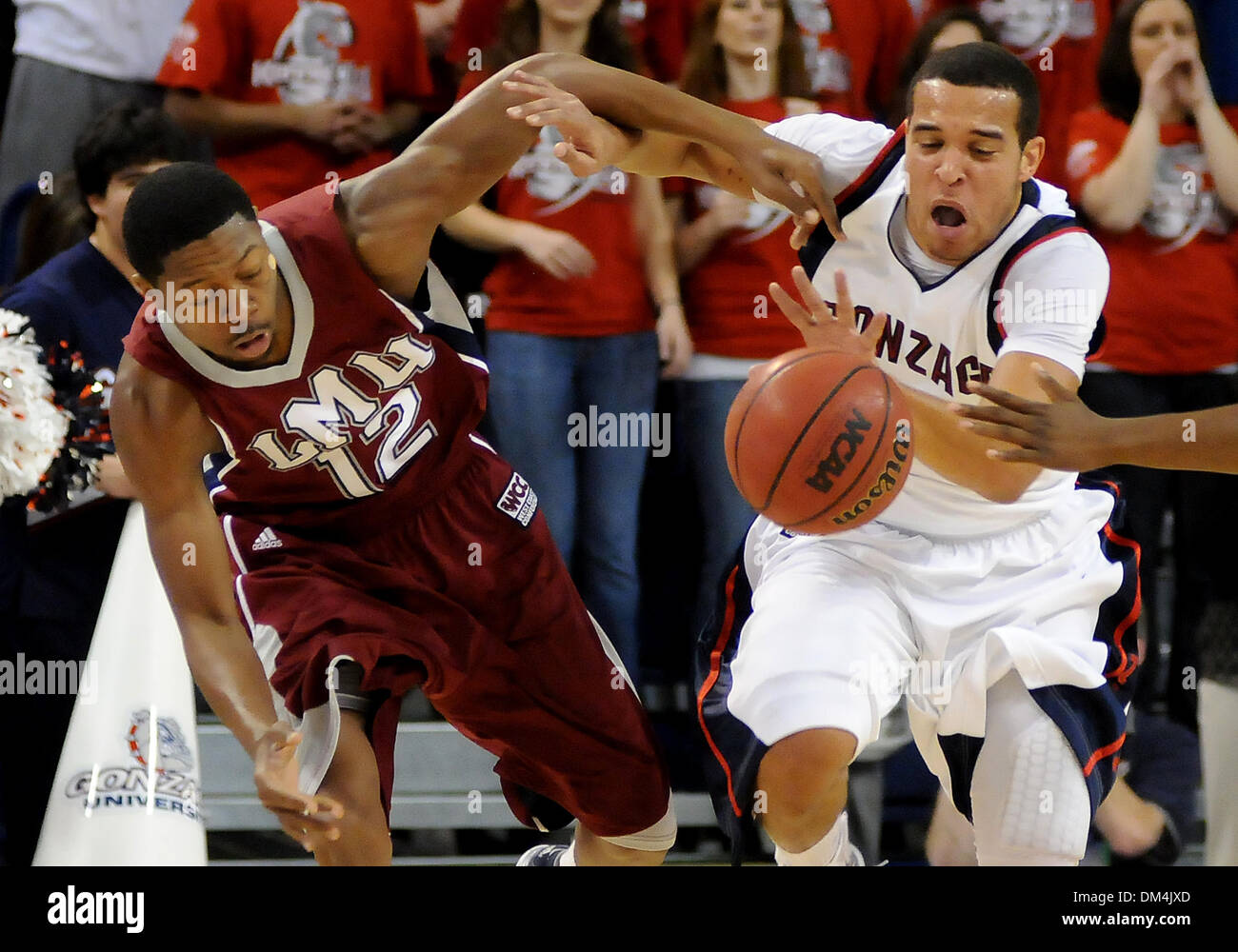 Gonzaga's forward Elias Harris, right, fights for the lose ball with ...