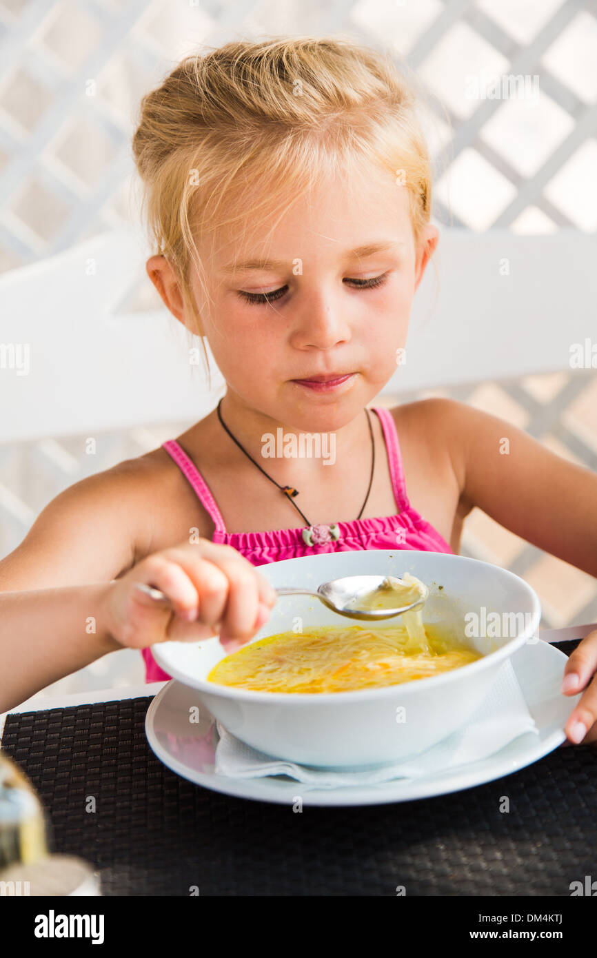 Cute child eating soup from the bowl, healthy food Stock Photo - Alamy
