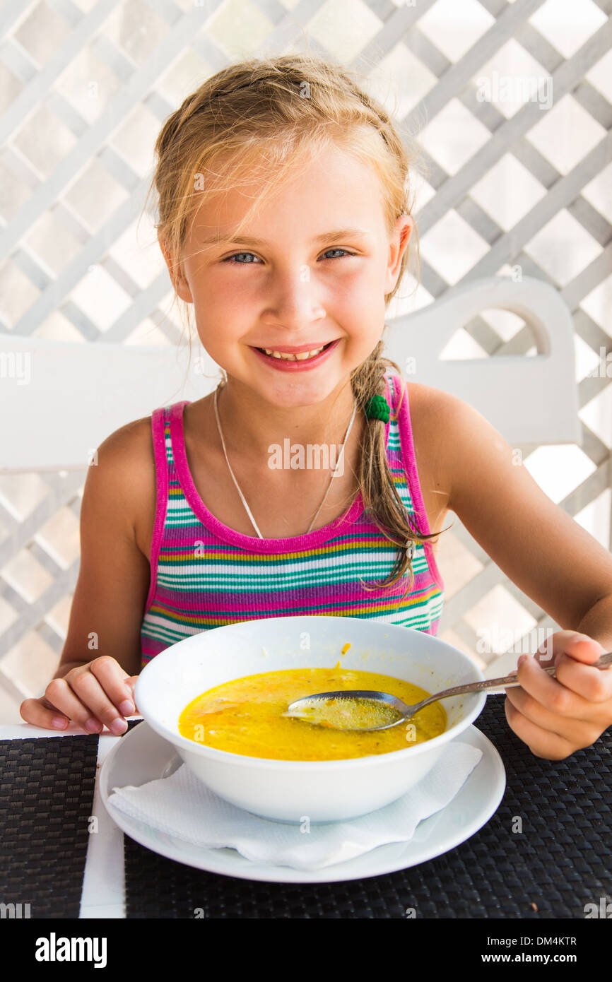 Cute child eating soup from the bowl, healthy food Stock Photo - Alamy