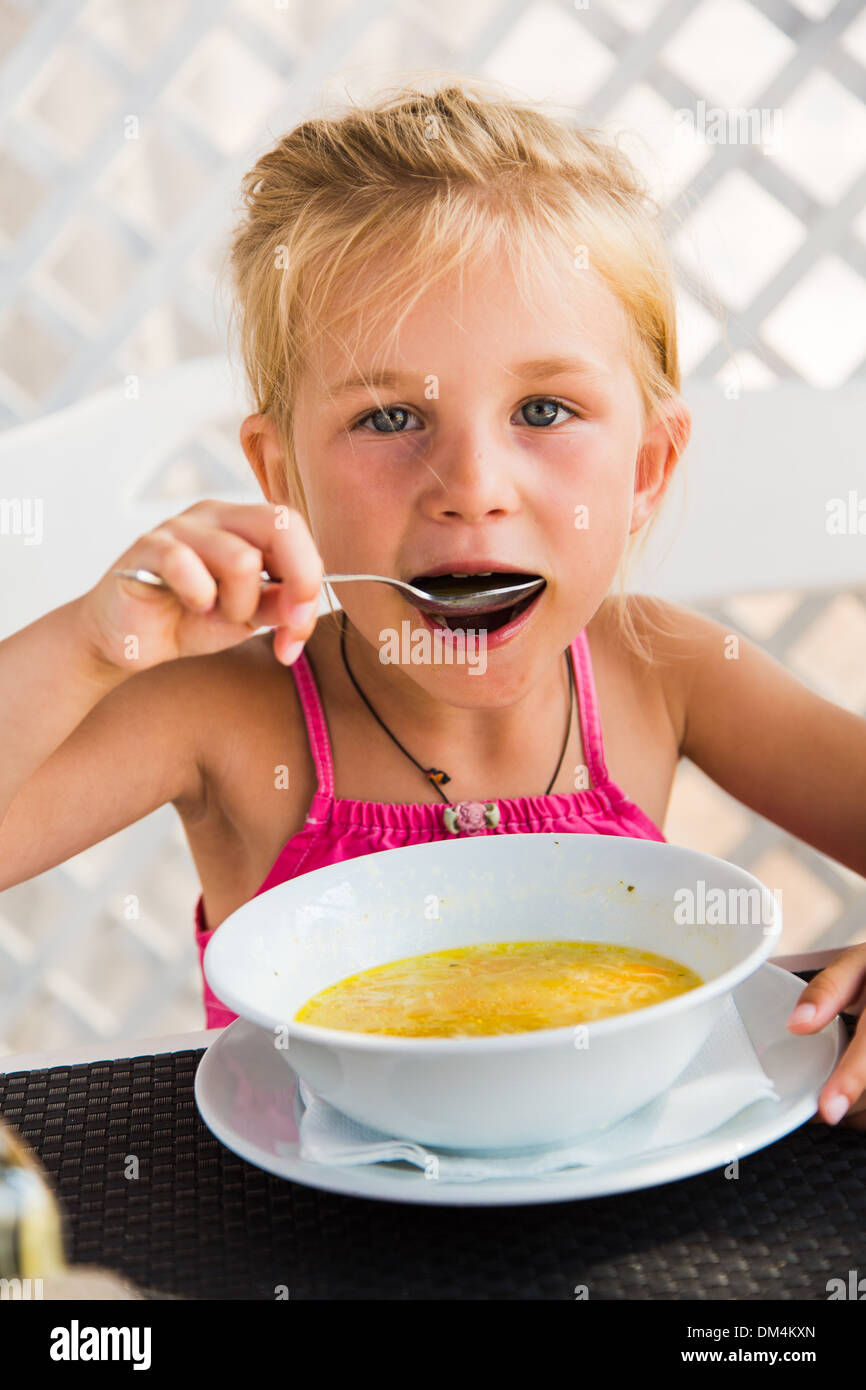 Cute child eating soup from the bowl, healthy food Stock Photo - Alamy