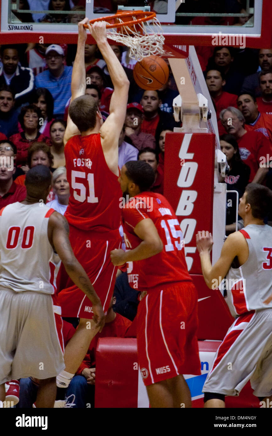 University of Utah center David Foster (51) using his 7-3 height to get ...