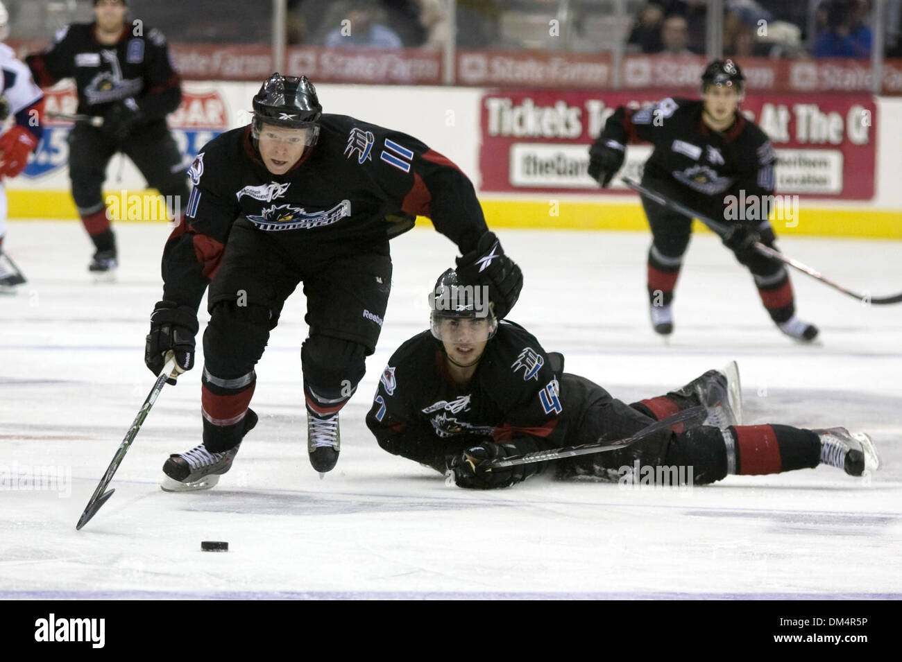 28 February 2010: Lake Erie Monsters Randy Rowe (11) chases a loose ...