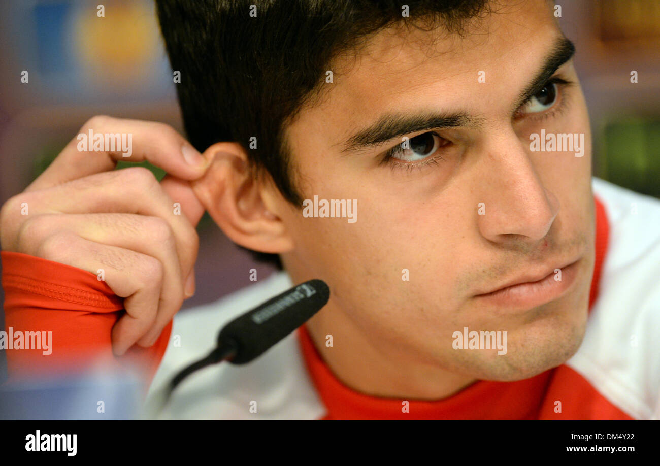 Freiburg, Germany. 11th Dec, 2013. FC Sevilla's Diego Perotti holds a ...