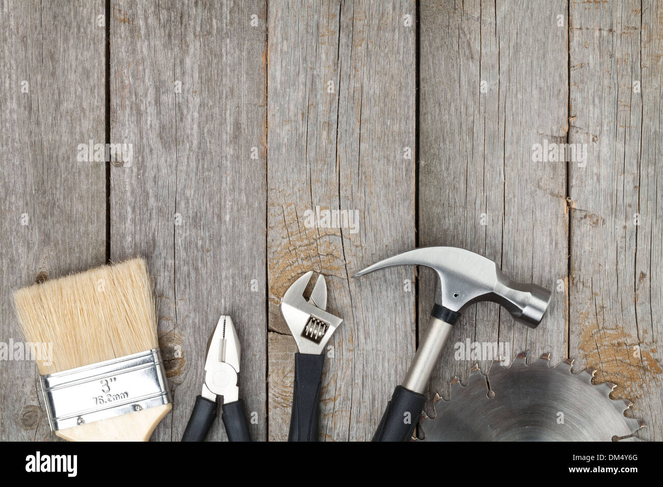 Set of tools on wood panel background with copy space Stock Photo - Alamy