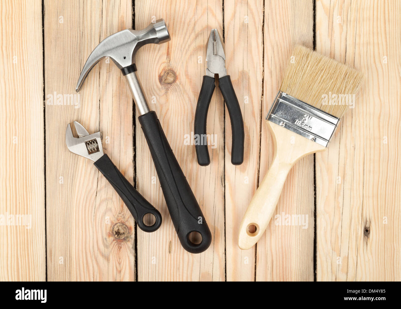 Set of tools on wood panel background Stock Photo - Alamy