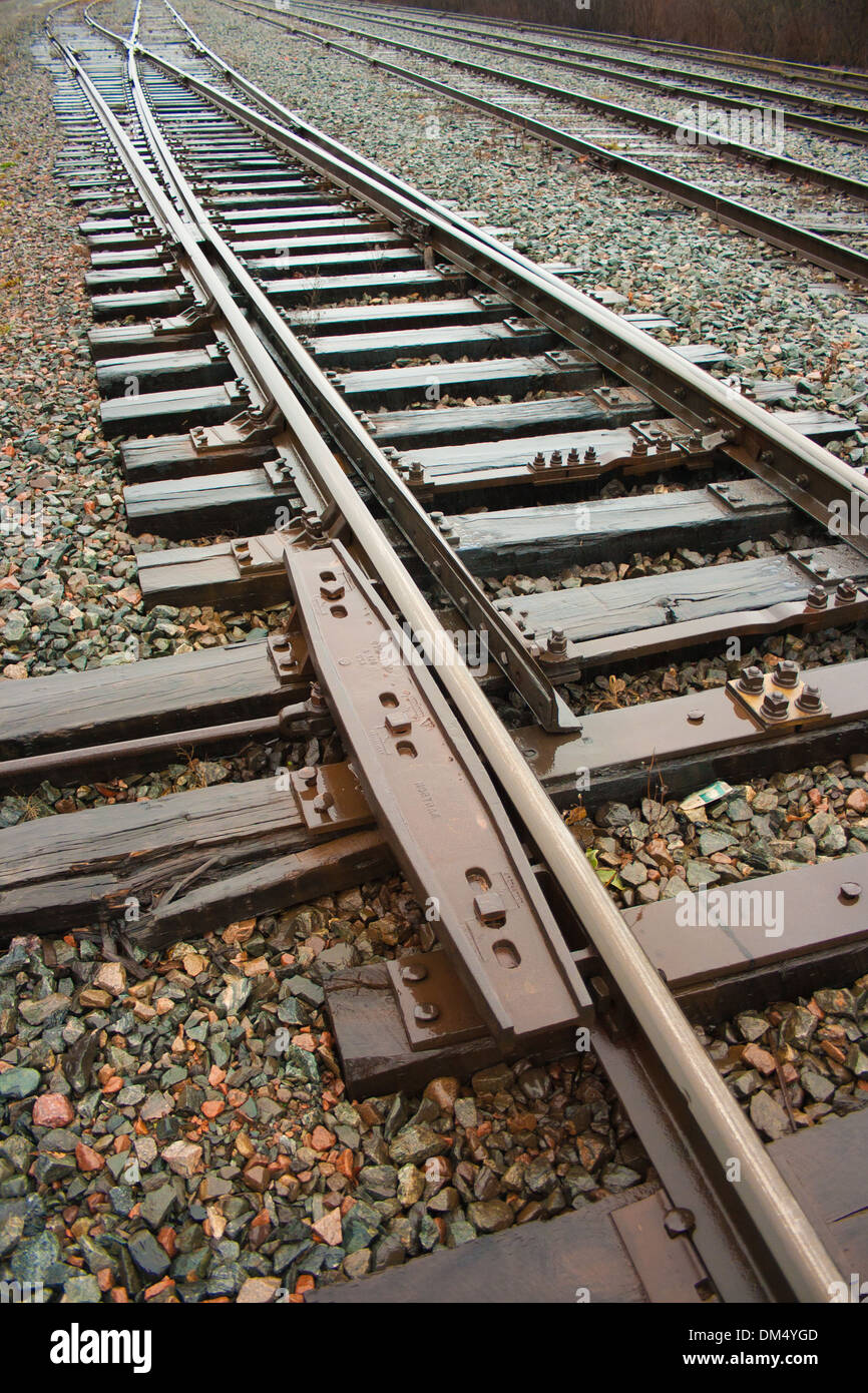 Wet railroad tracks detail Stock Photo - Alamy