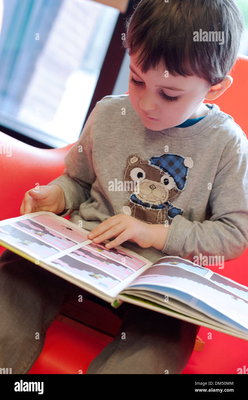 Boy child reading book hi-res stock photography and images - Alamy
