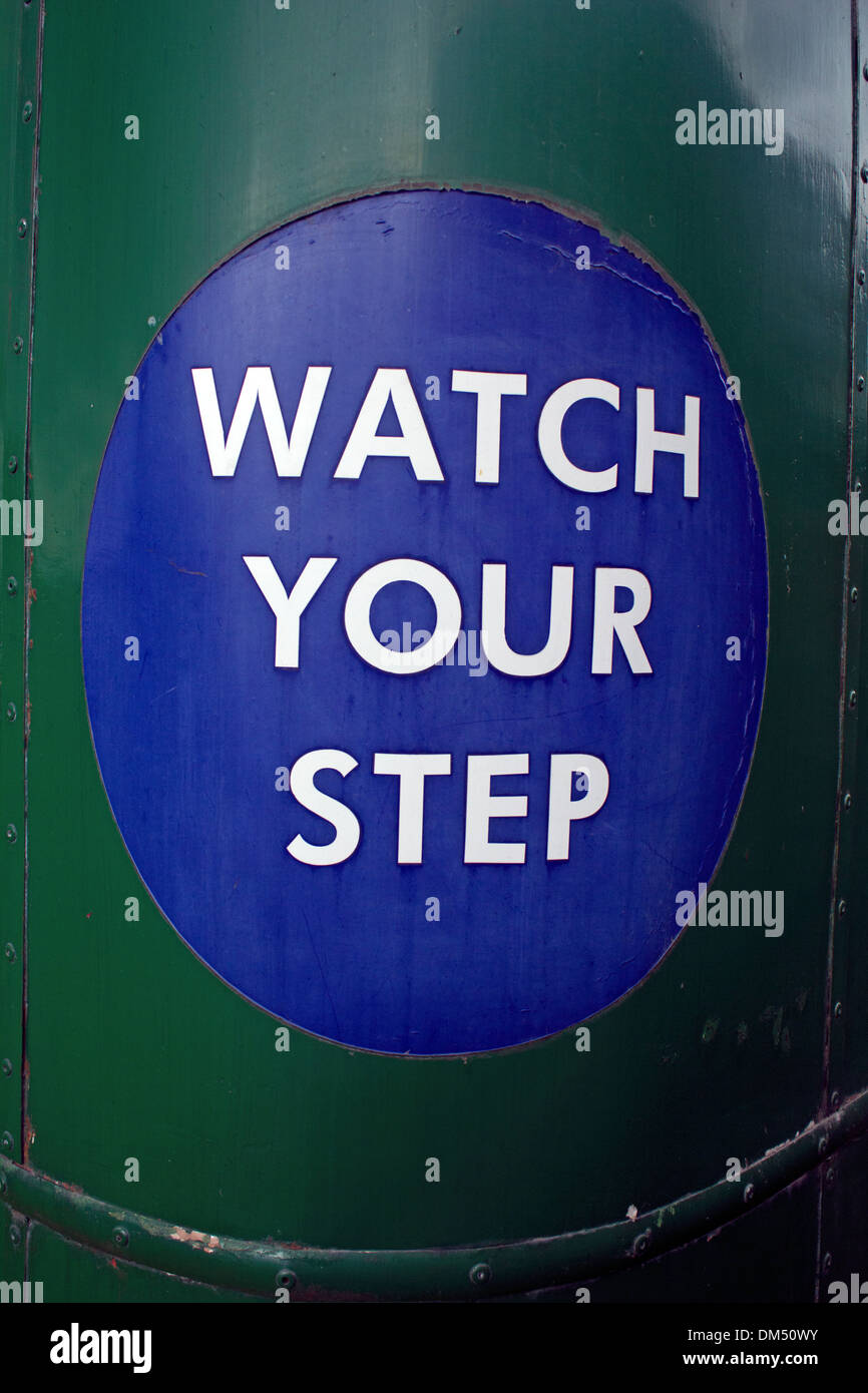 Watch Your Step Sign Stock Photo - Alamy
