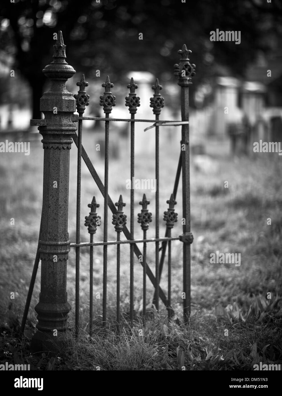 Old entrance gate and graves in an ancient church graveyard Stock Photo ...