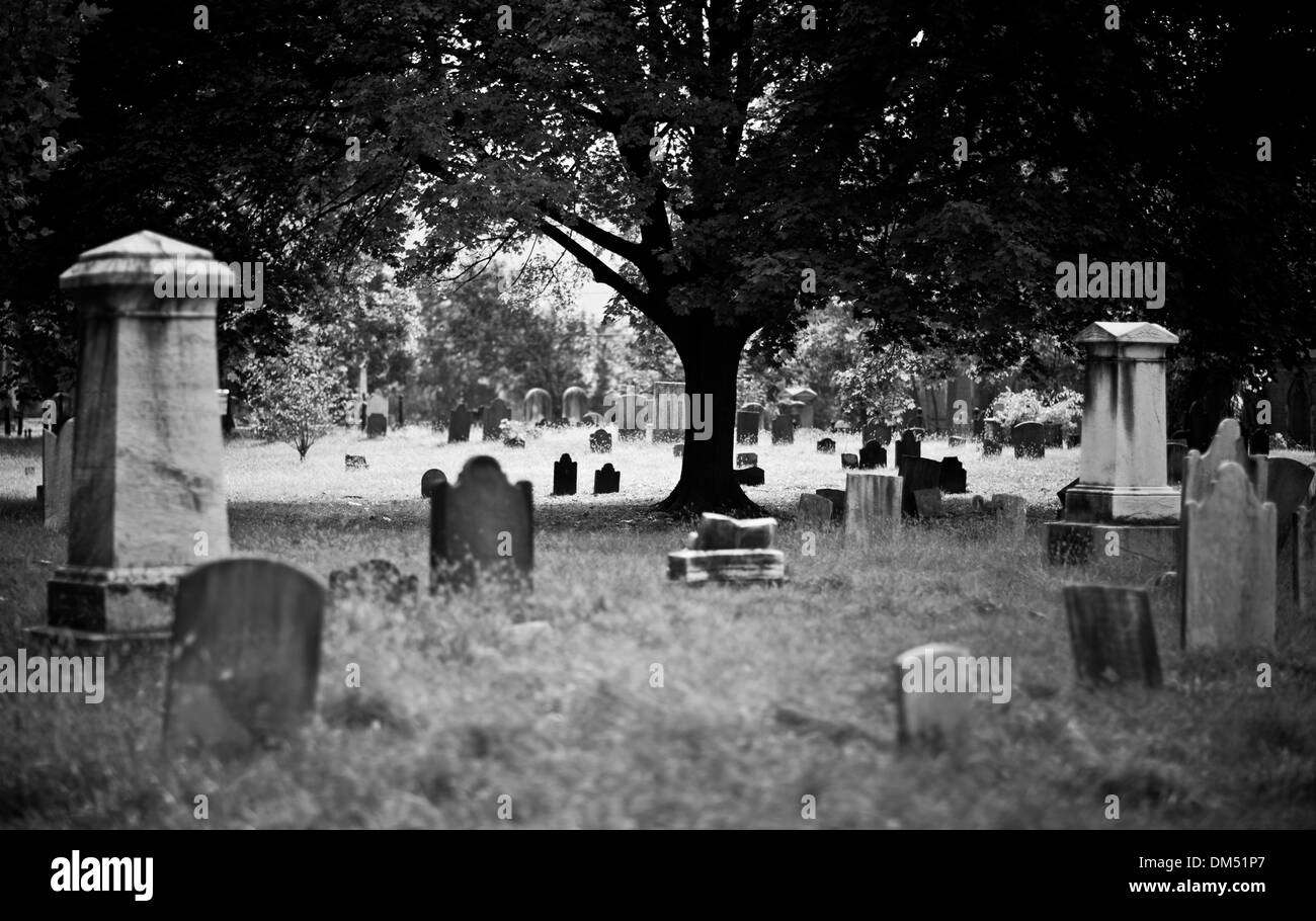 Tombstone and graves in an ancient church graveyard Stock Photo - Alamy
