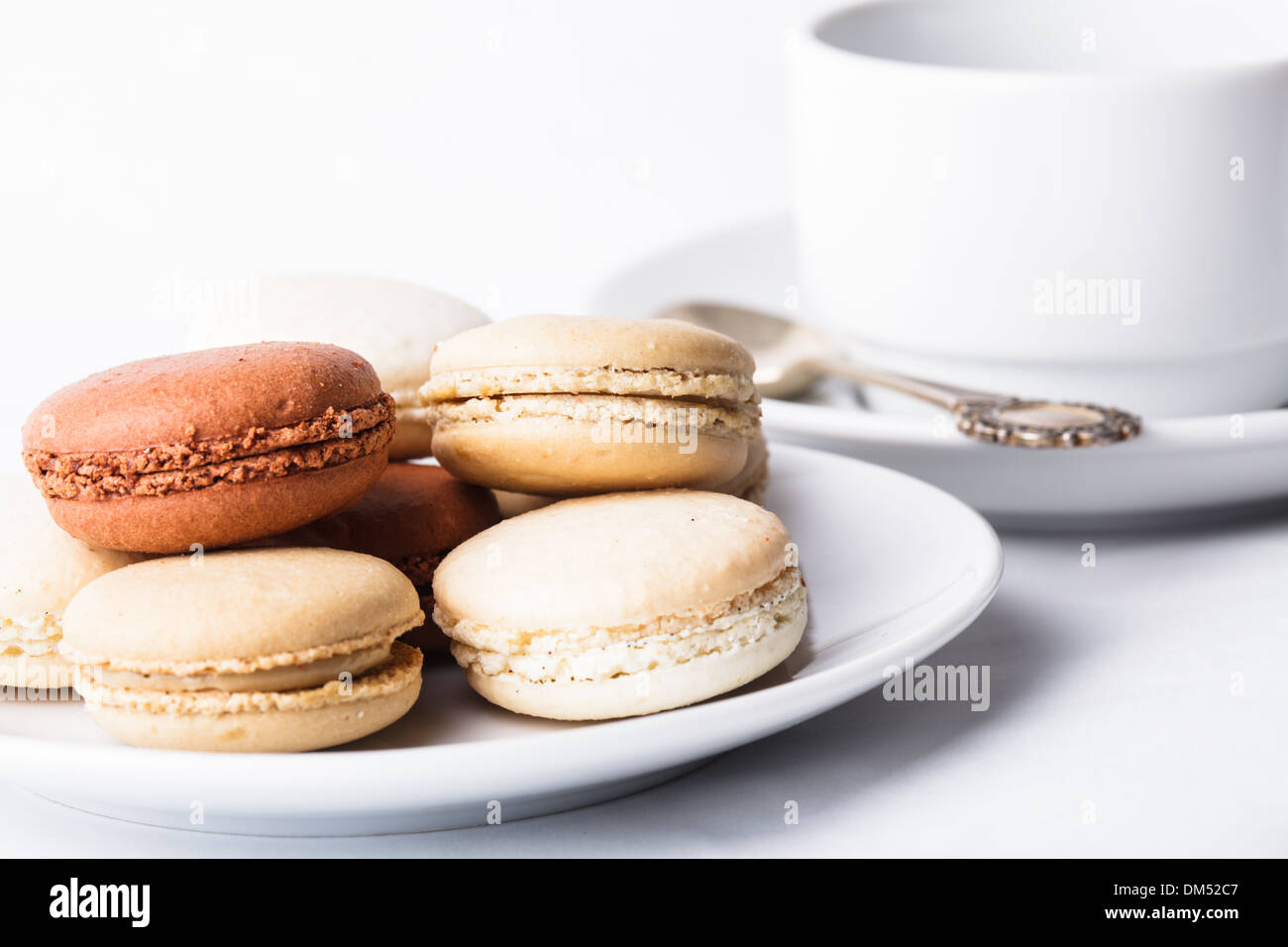 Three colors of macaroons in brown and beige tones Stock Photo - Alamy