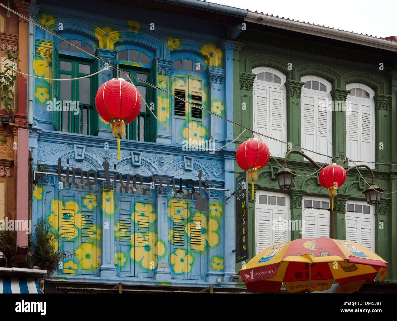 Chinese New Year decorations against colourful shuttered walls in ...