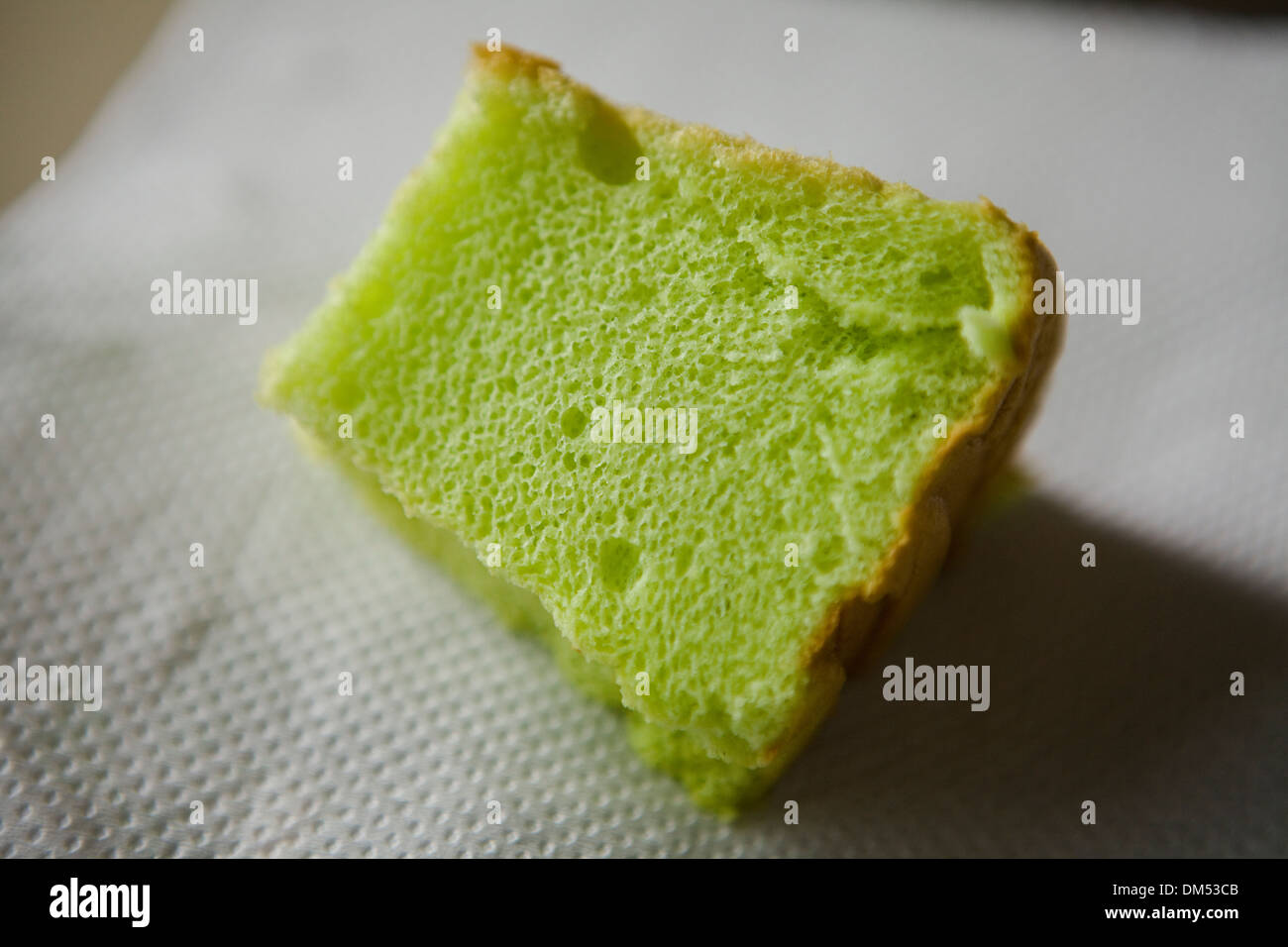 A slice of pandan cake, a light, fluffy cake of Malay origins ...