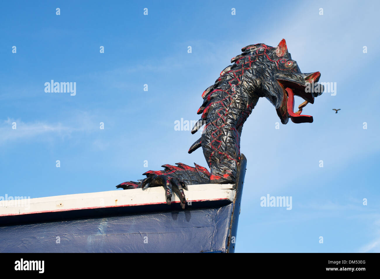 Dragon figurehead on fishing coble Seaton Sluice, north east England UK ...