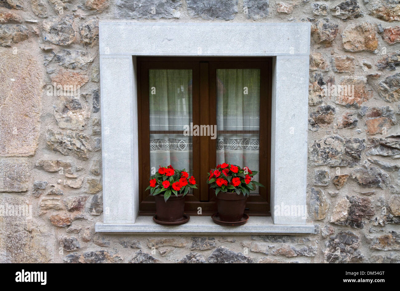 Residential housing with flowers in windows in the municipality of ...