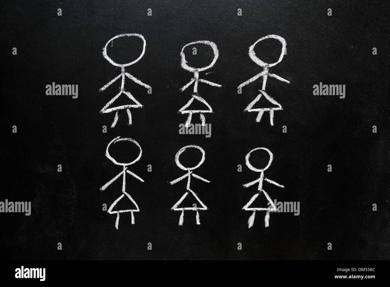 A group of female stick figures drawn on a blackboard in chalk Stock ...