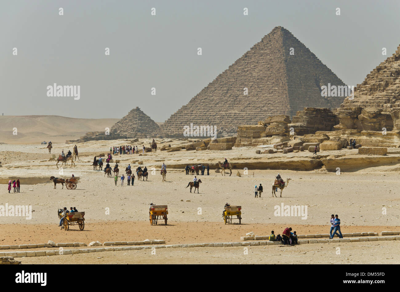 Tourists near famous Egyptian pyramids Stock Photo - Alamy